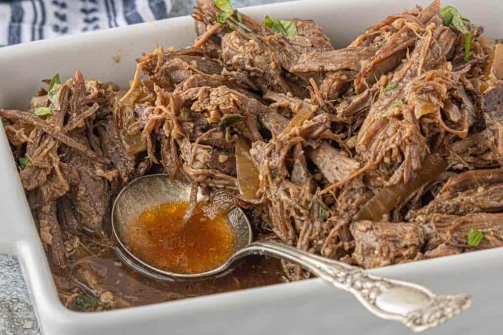 Tender and Juicy Slow Cooker Shredded Beef in a Rich Gravy - Bowl Me Over